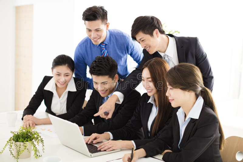 Happy Young Business People Working in Office Stock Photo - Image of ...