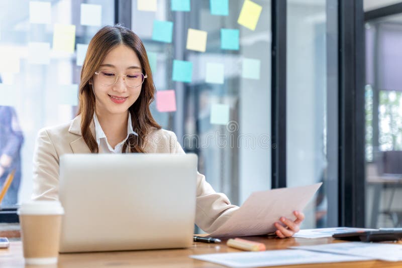 Happy Young Business Woman Working on Her Project at the Office Stock ...
