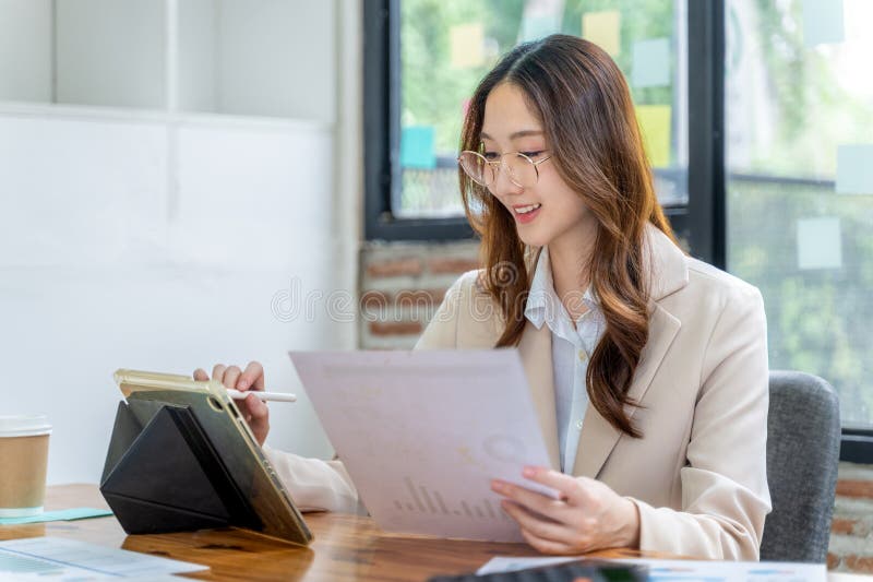 Happy Young Business Woman Working on Her Project at the Office Stock ...