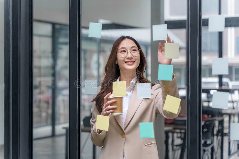 Happy Young Business Woman Working on Her Project at the Office and ...