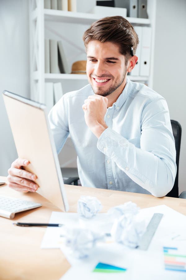 Happy Young Businessman Reading Notes in Notpad Stock Image - Image of ...