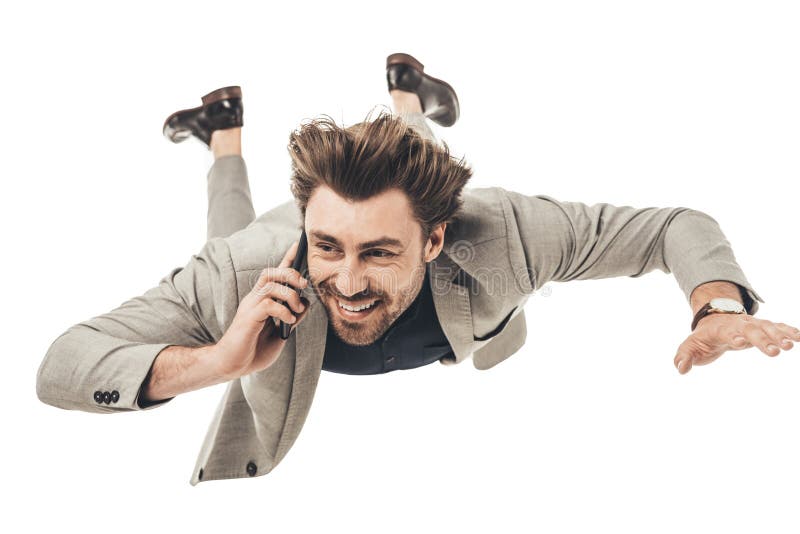 Happy Young Businessman Talking by Phone while Falling Stock Photo ...