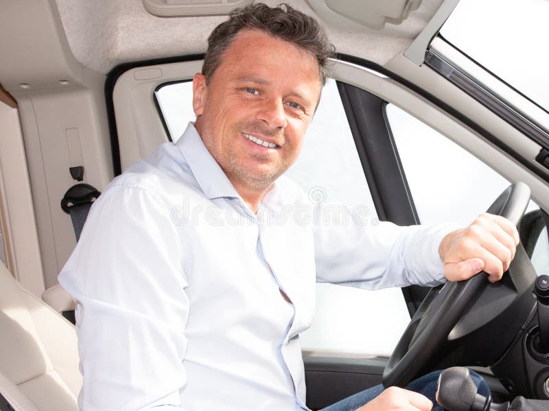 Happy Young Car Driver Behind Steering Wheel of Van Driving Concept ...
