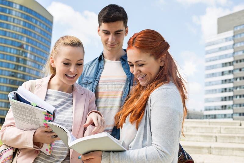 Happy Young College Students Studying Outdoors Stock Photo - Image of ...
