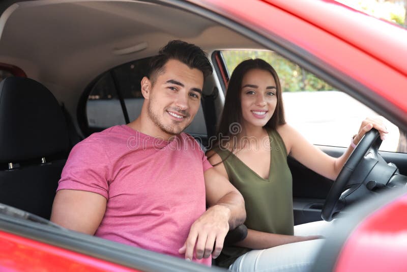 Happy young couple in car stock image. Image of holiday - 125072579