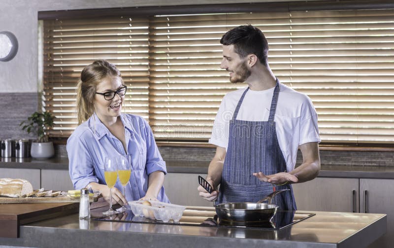 Happy Young Couple Cooking Breakfast Preparing in the Kitchen Stock ...