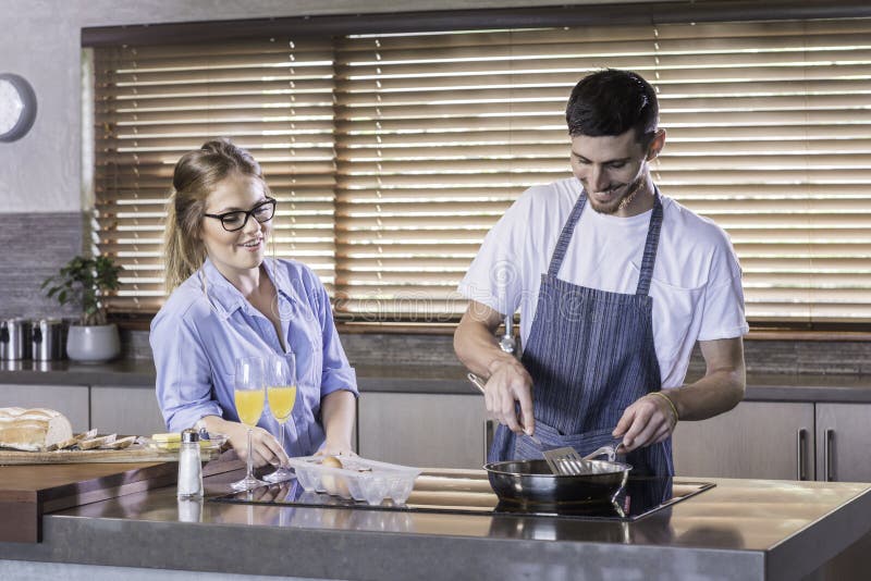 Happy Young Couple Cooking Breakfast Preparing in the Kitchen Stock ...