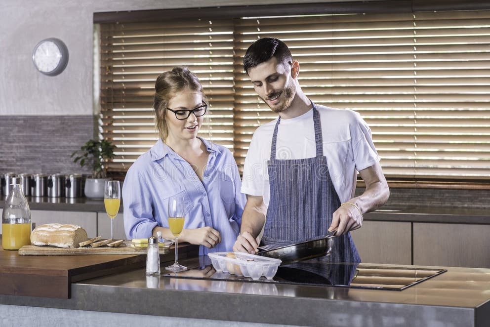 Happy Young Couple Cooking Breakfast Preparing in the Kitchen Stock ...