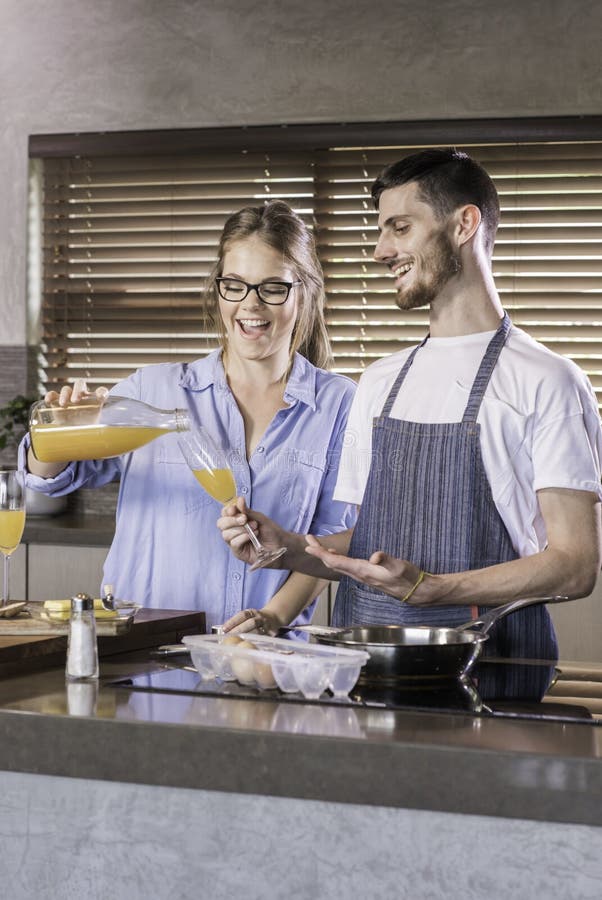 Happy Young Couple Cooking Breakfast Preparing in the Kitchen Stock ...