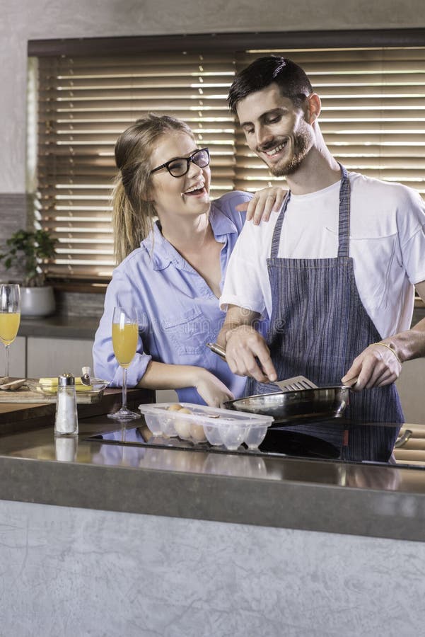 Happy Young Couple Cooking Breakfast Preparing in the Kitchen Stock ...
