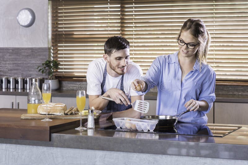 Happy Young Couple Cooking Breakfast Preparing in the Kitchen Stock ...