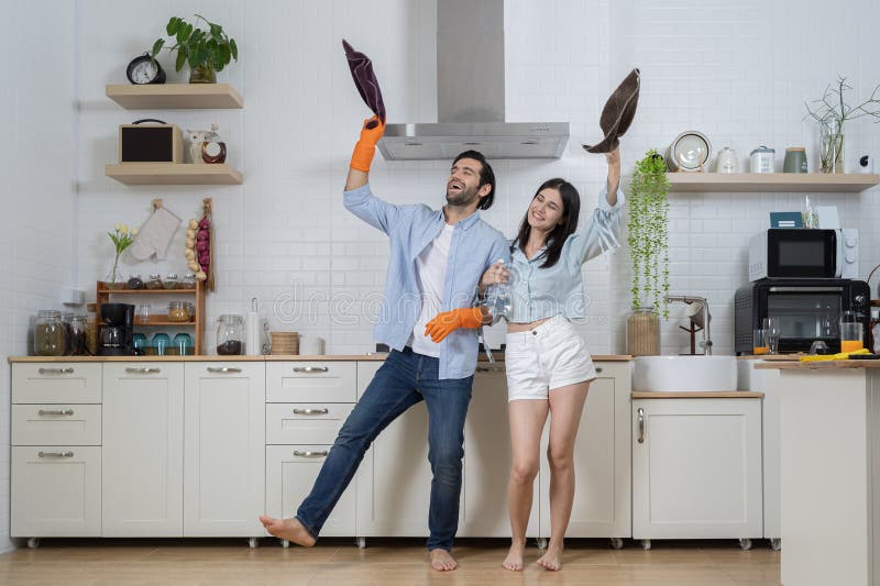 Joyful Woman Singing Songs And Dancing With Closed Eyes While Cleaning