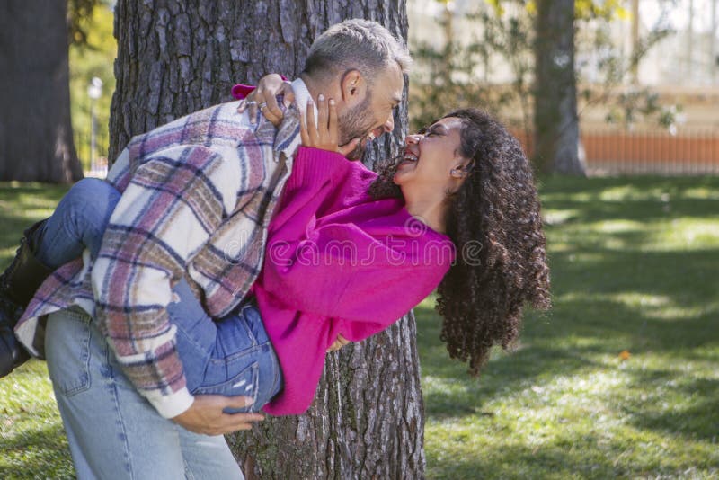 Happy Young Couple Embracing in the Park Stock Image - Image of adult ...