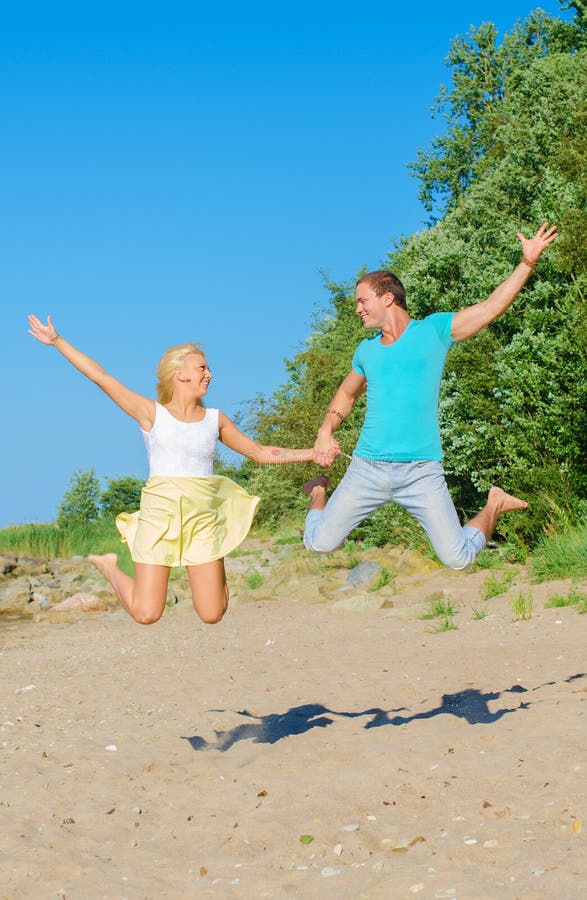 Happy Young Couple Having Fun. Stock Photo - Image of person, jump ...