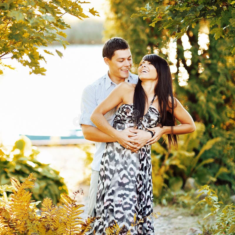 Couple Hugging in a Park - Soft Warm Colors Stock Image - Image of ...
