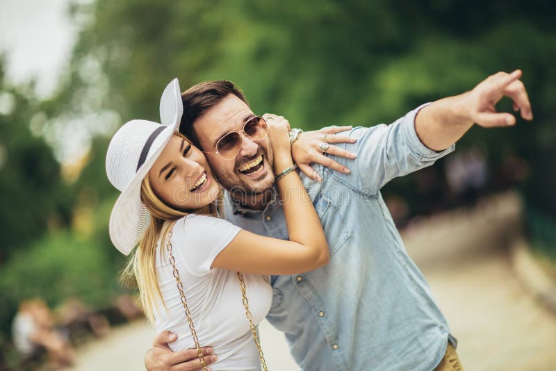 Young Couple Having Fun Outdoors and Smiling Stock Image - Image of ...