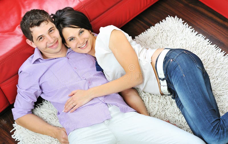 Happy young couple at home stock image. Image of adult - 25508727