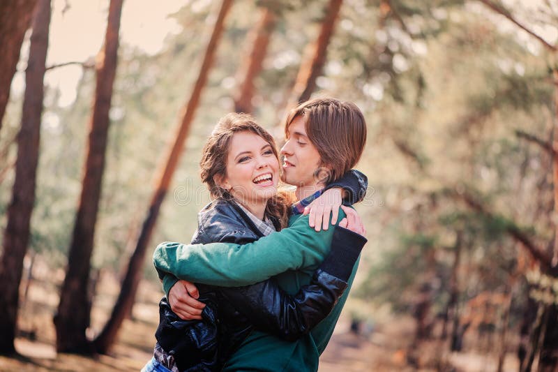 Happy Young Couple Hugs on the Walk in Forest Stock Photo - Image of ...