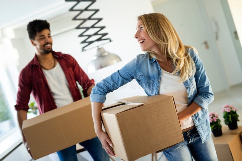 Happy Young Couple Moving in New House Stock Photo - Image of casual ...