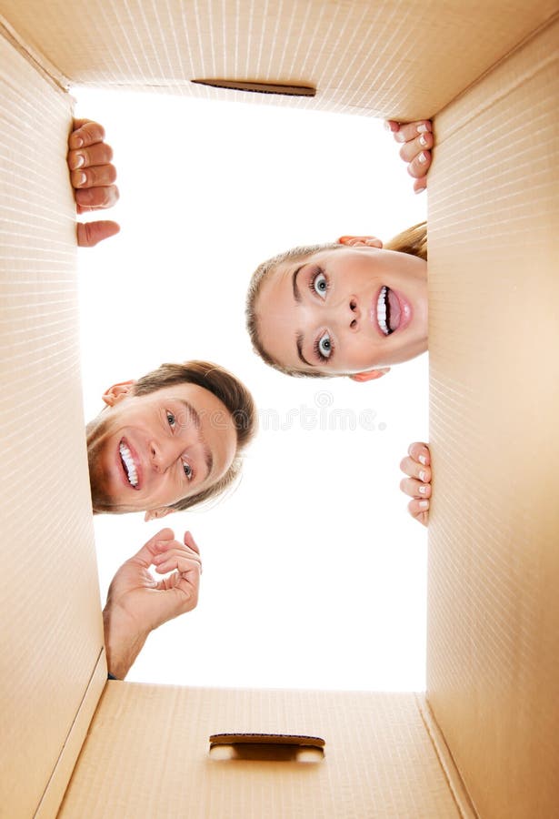 Girl Opening a Carton Box and Looking Inside Stock Photo - Image of ...