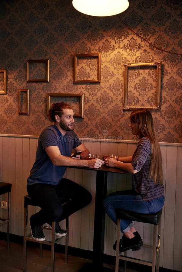 Happy Young Couple at a Pub Stock Photo - Image of dating, leisure ...