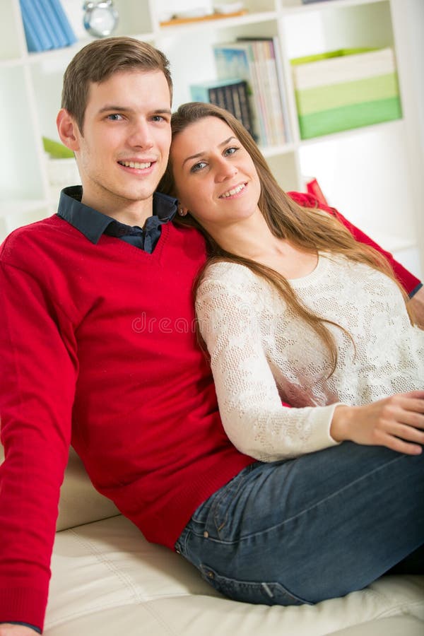 Happy Young Couple Relaxing in the Living Room. Stock Photo - Image of ...