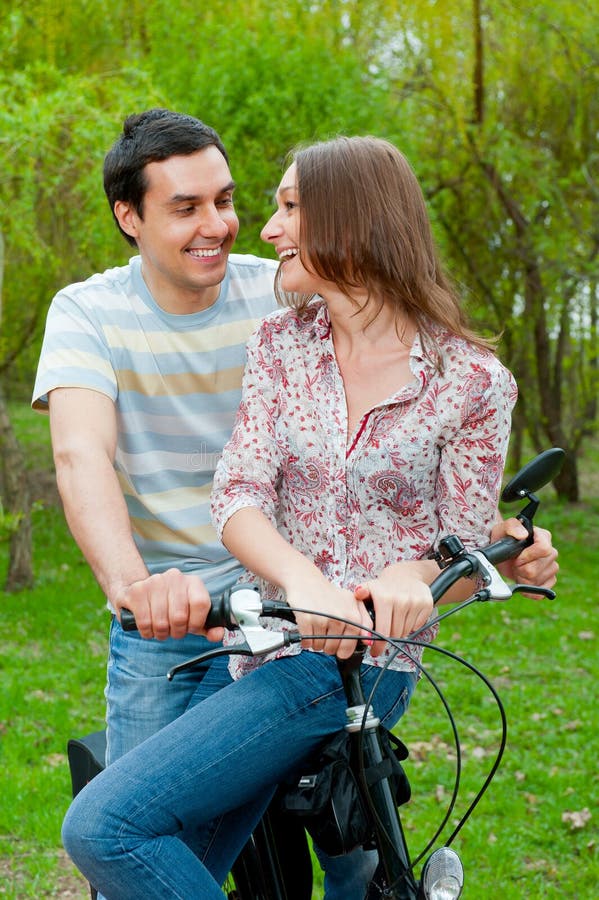 Happy Young Couple Riding Bicycles Stock Image - Image of healthy ...