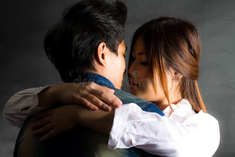Back View of a Couple Cuddling in Winter Stock Photo - Image of date ...