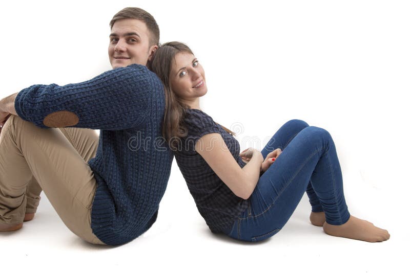 Happy Young Couple Sitting Back To Back Stock Photo - Image of joyful ...