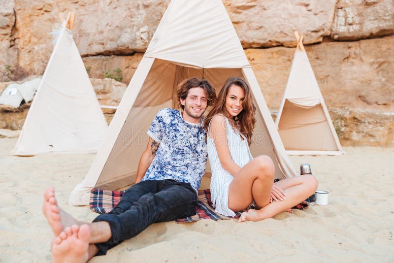 Happy Young Couple Sitting in Teepee on the Beach Stock Image - Image ...