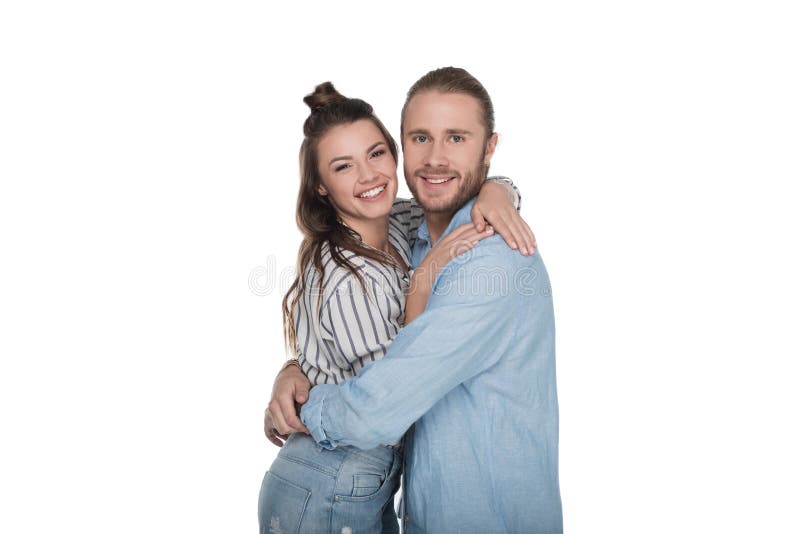 Happy Young Couple Standing Embracing and Smiling at Camera Stock Photo ...