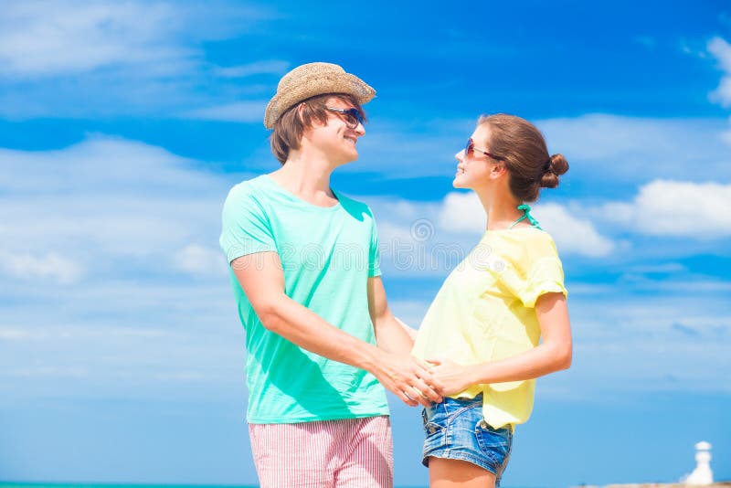 Happy Young Couple in Sunglasses Smiling Pointing Stock Image - Image ...
