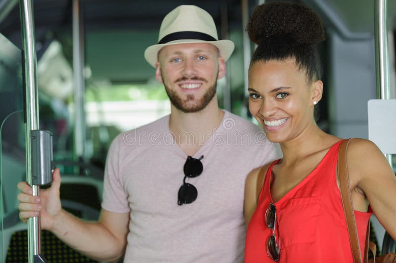 Happy Young Couple Taking in Bus Stock Image - Image of caucasianwoman ...