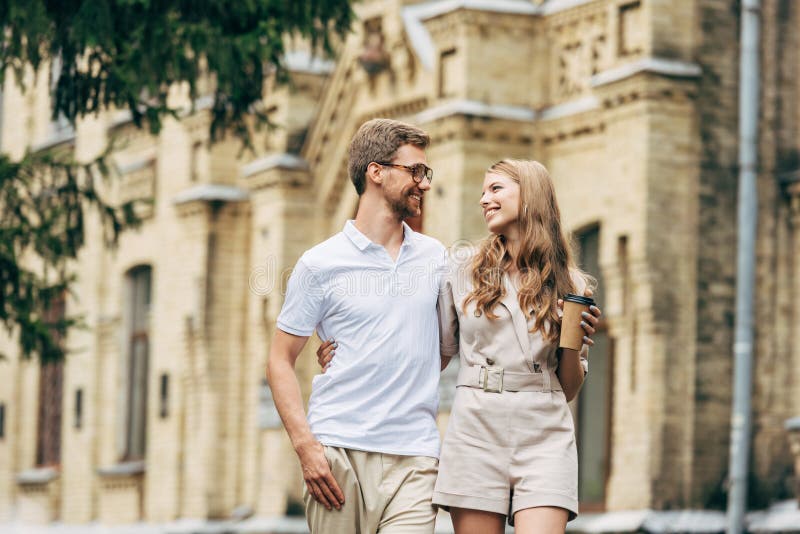 Happy Young Couple Taking Walk Together and Looking Stock Image - Image ...