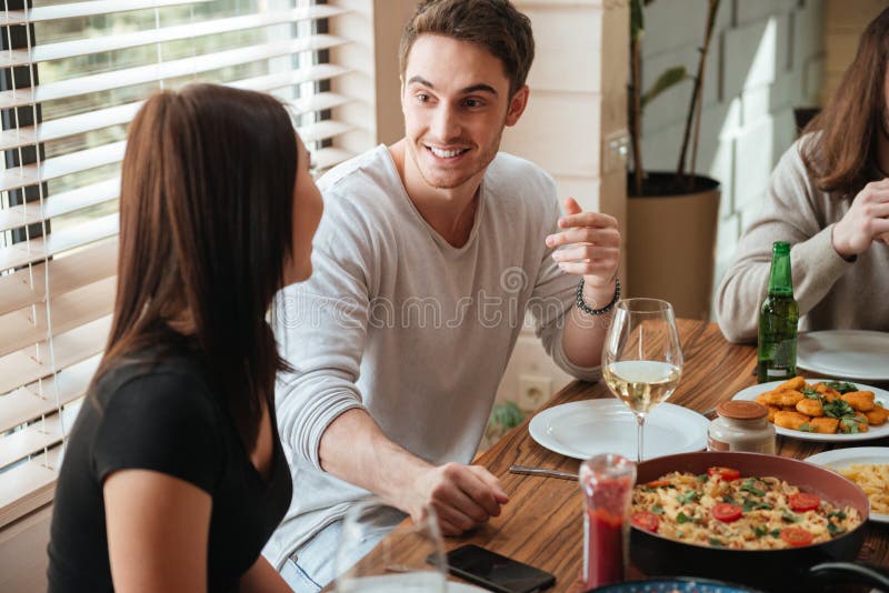 Happy Young Couple Talking at the Table at Home Stock Image - Image of ...