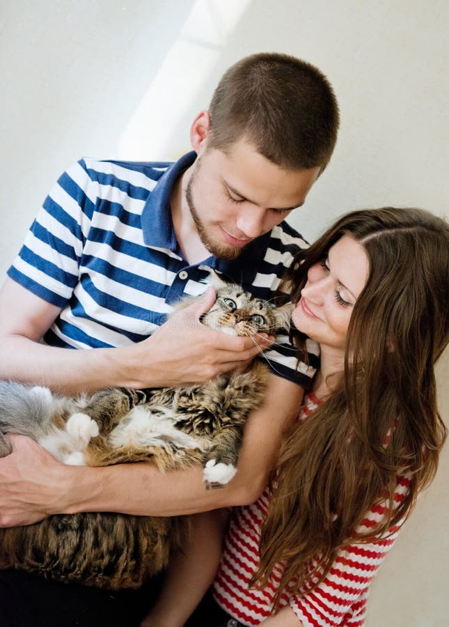 Happy Young Couple With Their Cat Stock Image - Image of play, rest ...