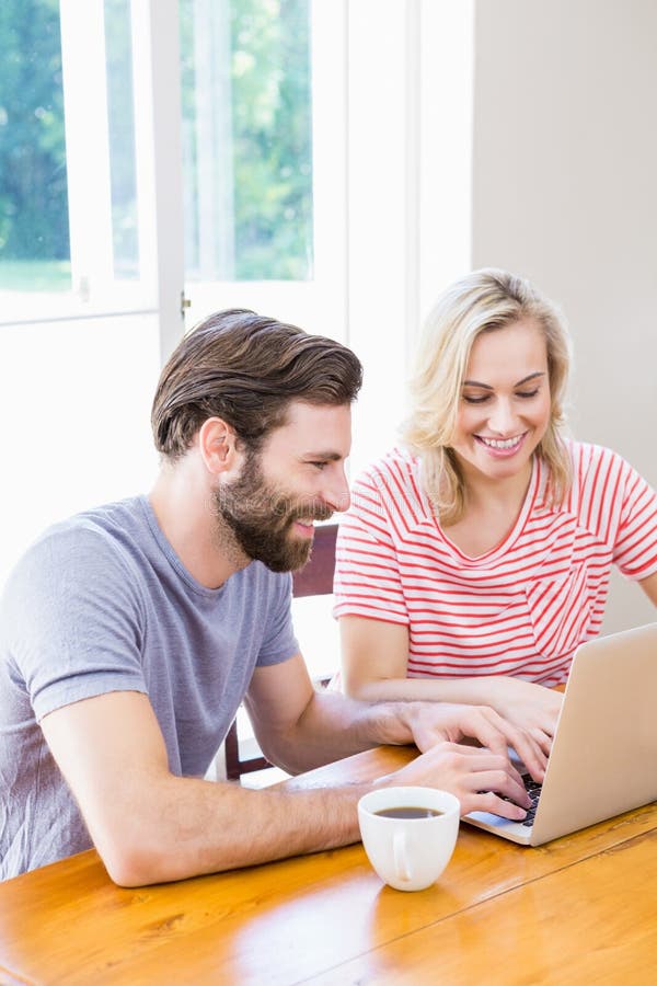 Happy Young Couple Using Laptop Stock Image - Image of internet, home ...