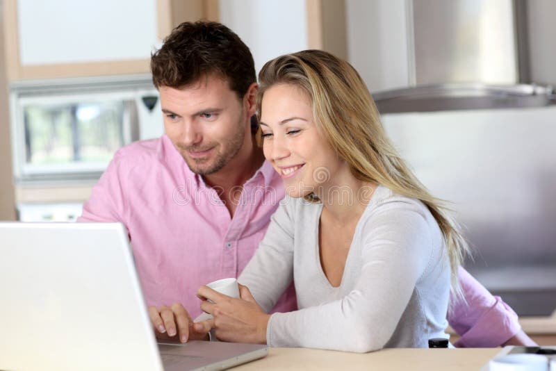 Happy Young Couple Working on Laptop Stock Image - Image of women ...