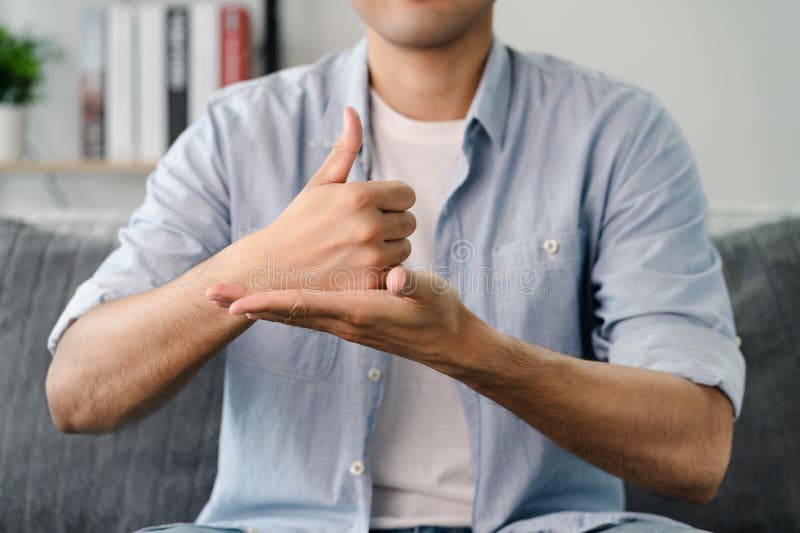 Happy Young Deaf Man Using Sign Language To Communicate with Other ...