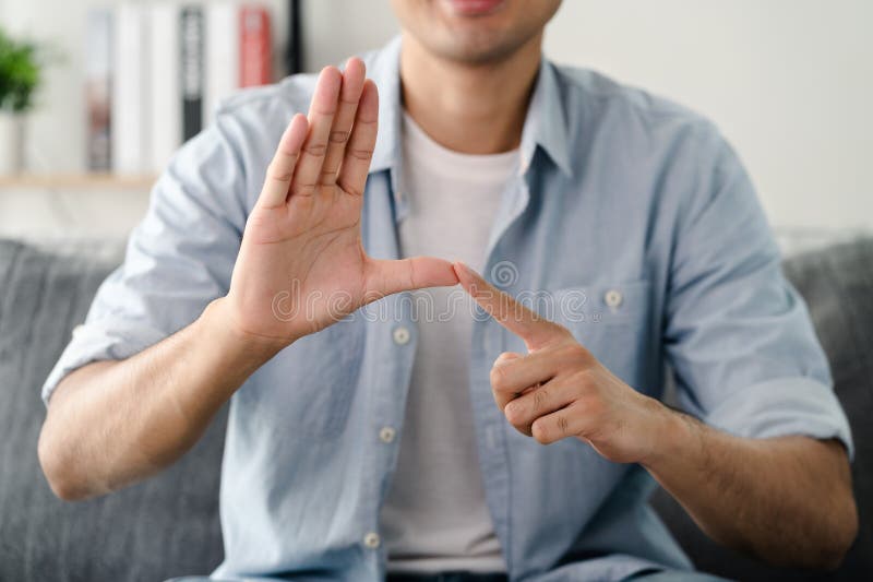 Happy Young Deaf Man Using Sign Language To Communicate with Other ...
