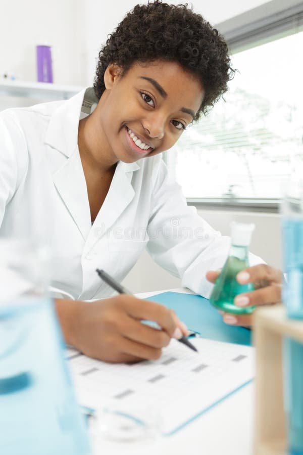 Happy Young Doctor Making Notes in Lab Stock Image - Image of note ...