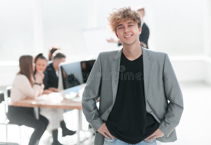 Happy Young Employee Standing in the Office. Stock Image - Image of ...