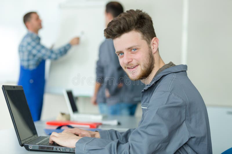 Happy Young Engineer with Laptop Testing Stock Photo - Image of ...
