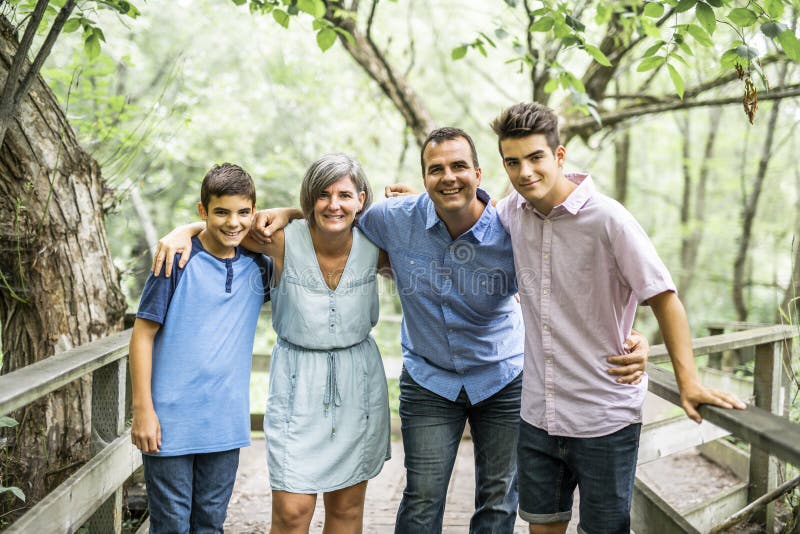 Happy Young Family in Forest Having Fun Together Stock Image - Image of ...