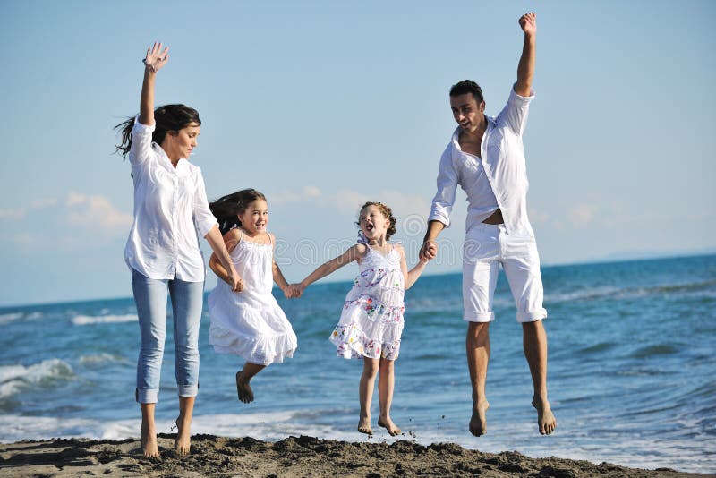 Happy Young Family Have Fun on Beach Stock Photo - Image of girl, shore ...