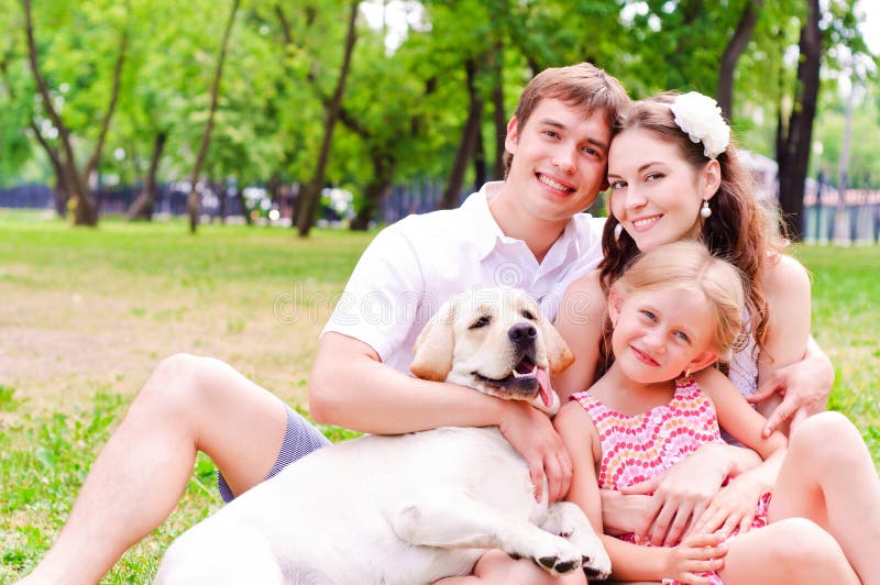 Happy Young Family with Labrador Stock Photo - Image of adult, love ...