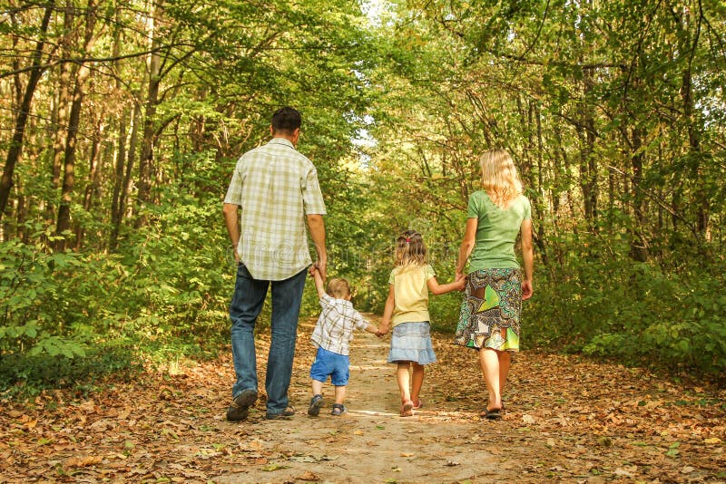Happy Young Family in Nature Stock Photo - Image of kids, smiling ...