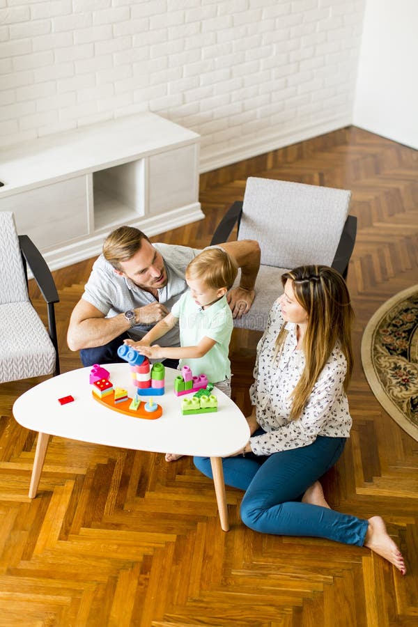 Happy Young Family Playing in Room Stock Image - Image of mother ...