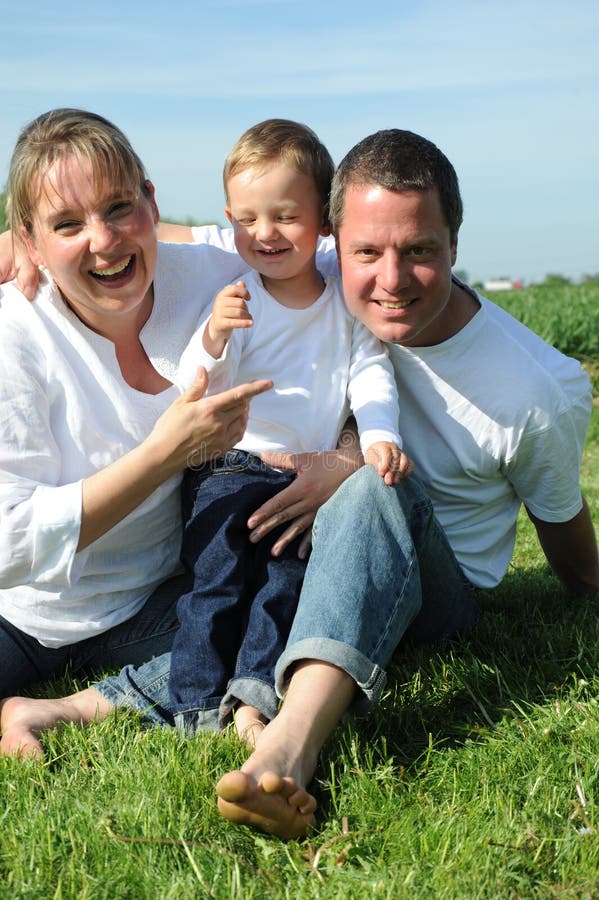 Happy Young Family with Small Child Stock Photo - Image of education ...