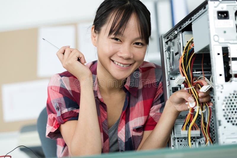 Happy Young Female Pc Technician in Class Stock Image - Image of ...